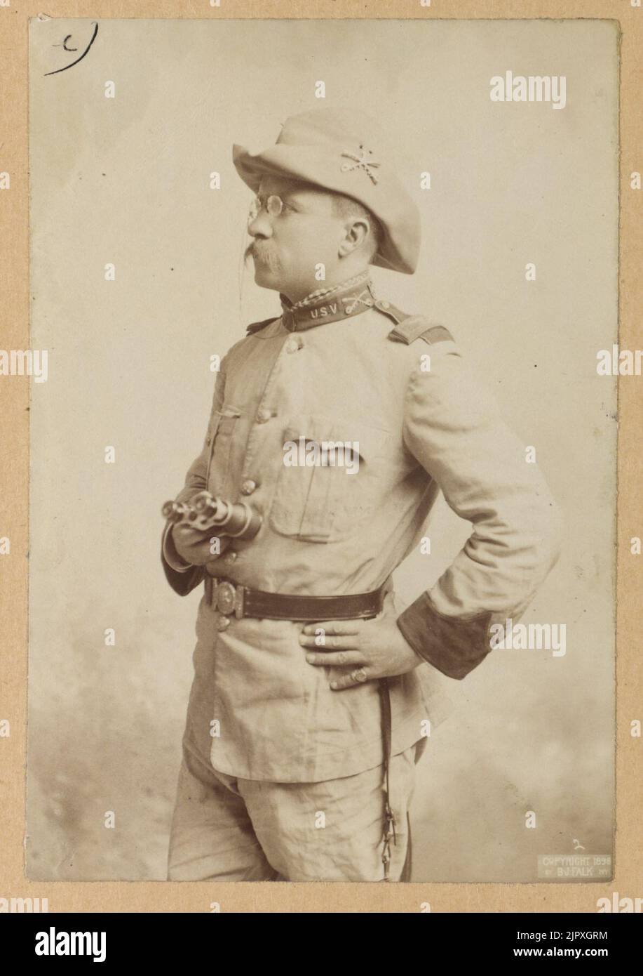 Theodore Roosevelt, three-quarter length portrait, holding a binocular ...