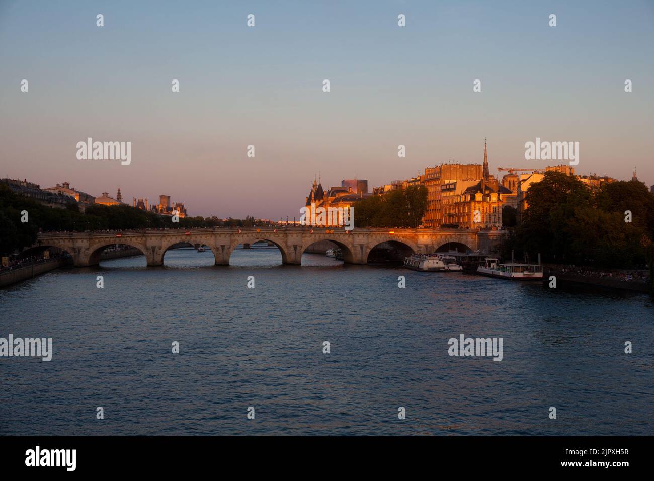 View of the River Seine and the famous bridge called Pont Neuf at sunny ...