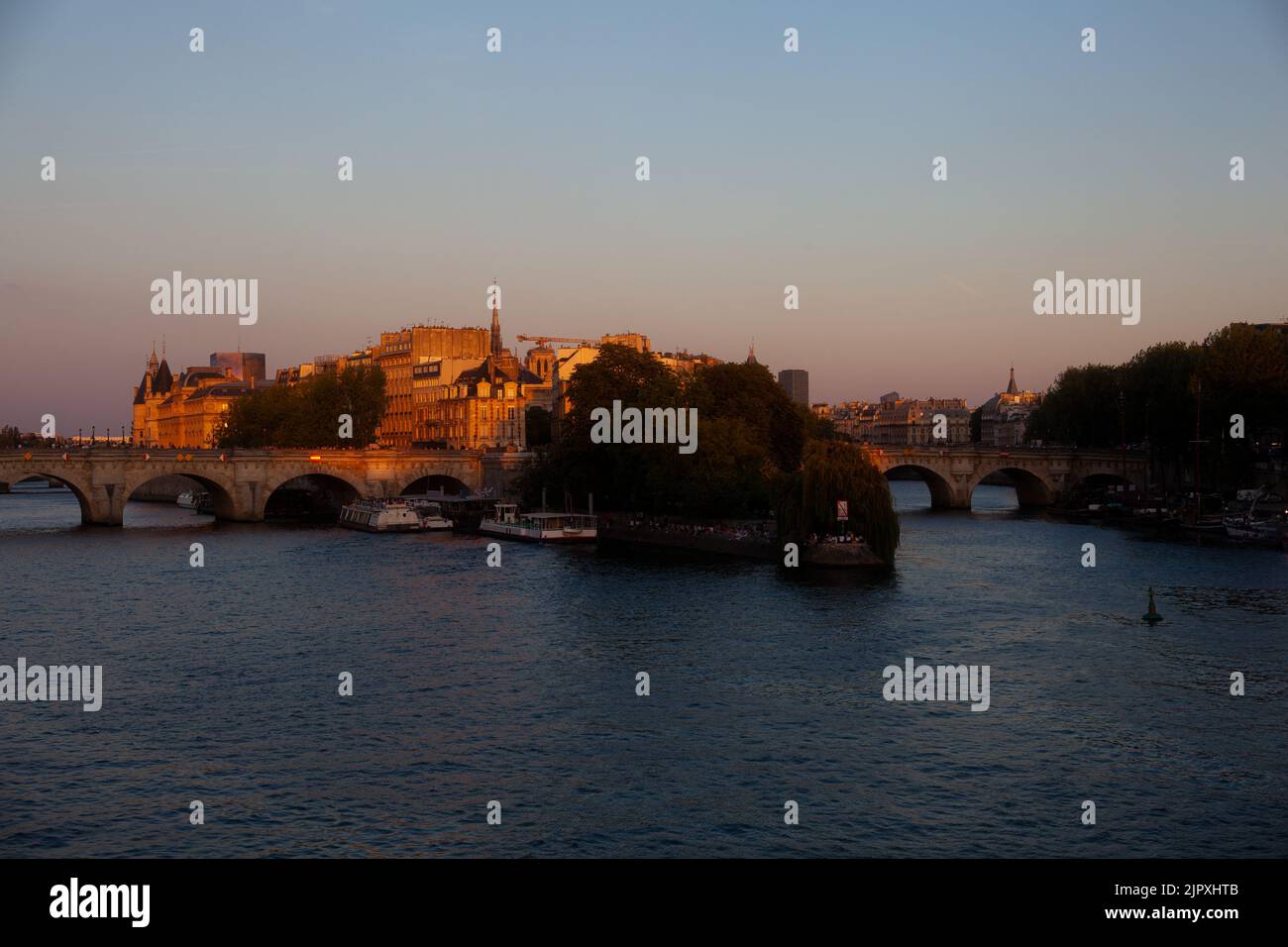 View of the River Seine and the famous bridge called Pont Neuf at sunny ...