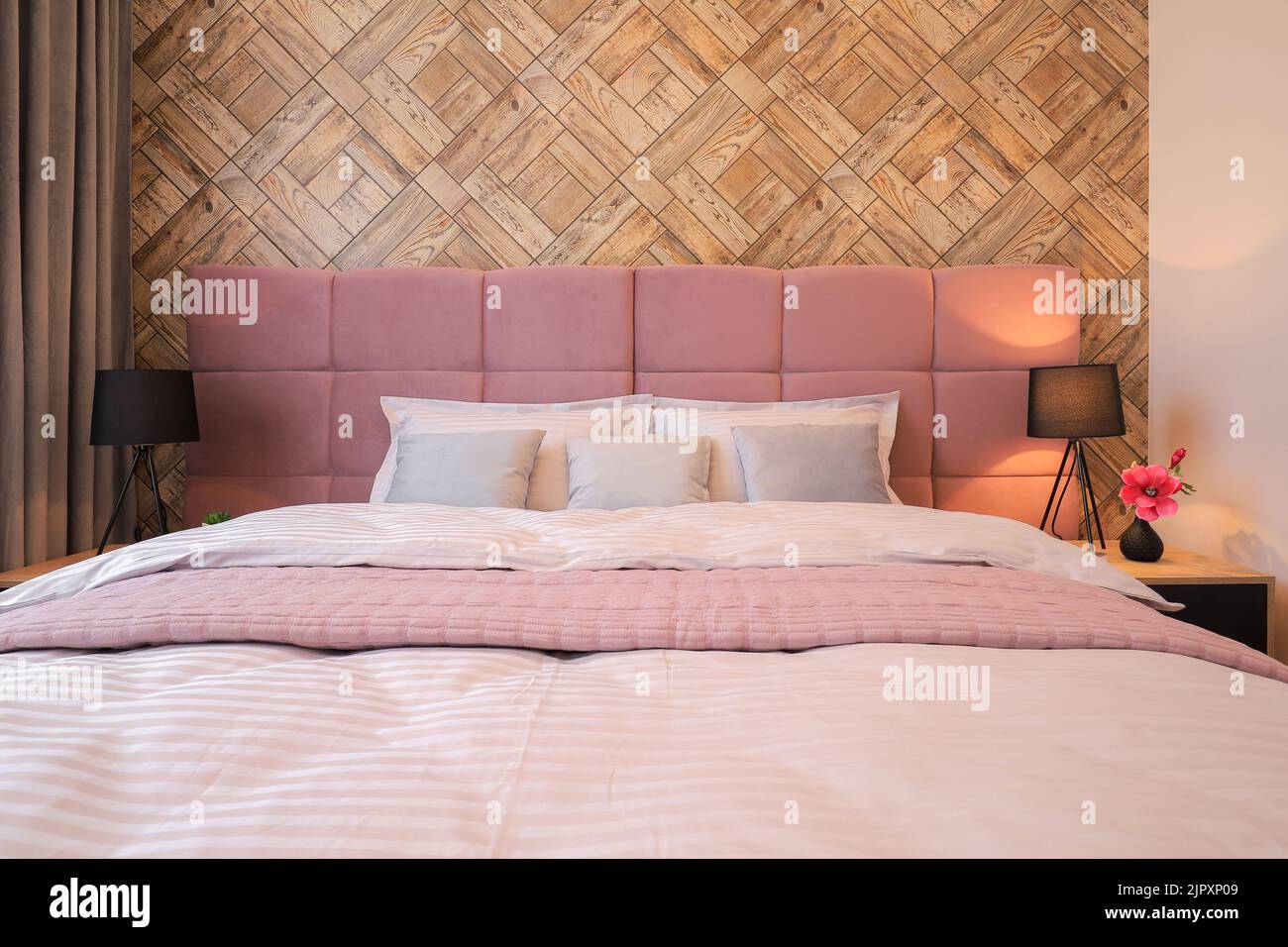 Double bed in a modern bedroom interior design Stock Photo - Alamy