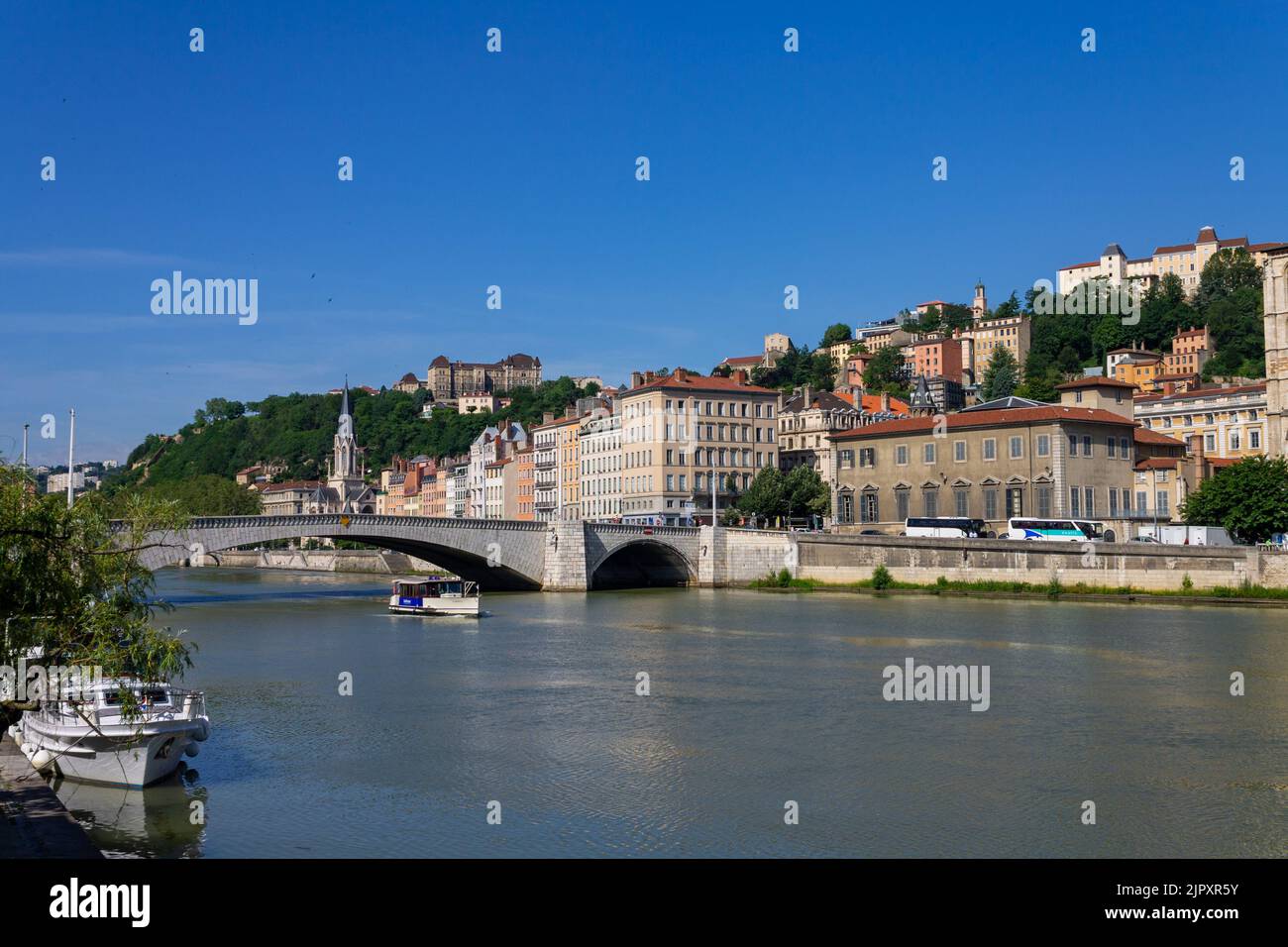 The Bonaparte bridge over the Saone river and the historical buildings ...