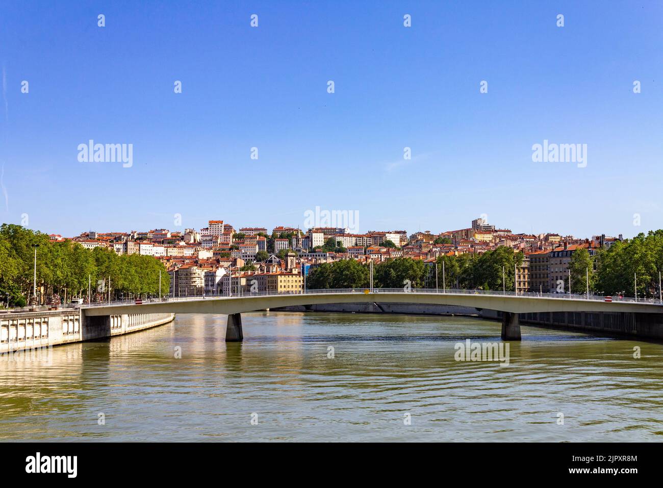 The Bonaparte bridge over the Saone river and the historical buildings ...