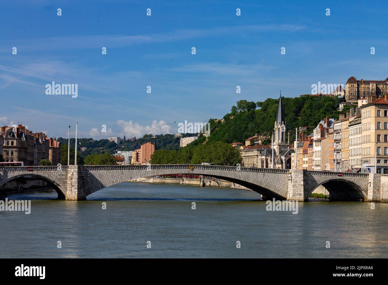 The Bonaparte bridge over the Saone river and the historical buildings ...