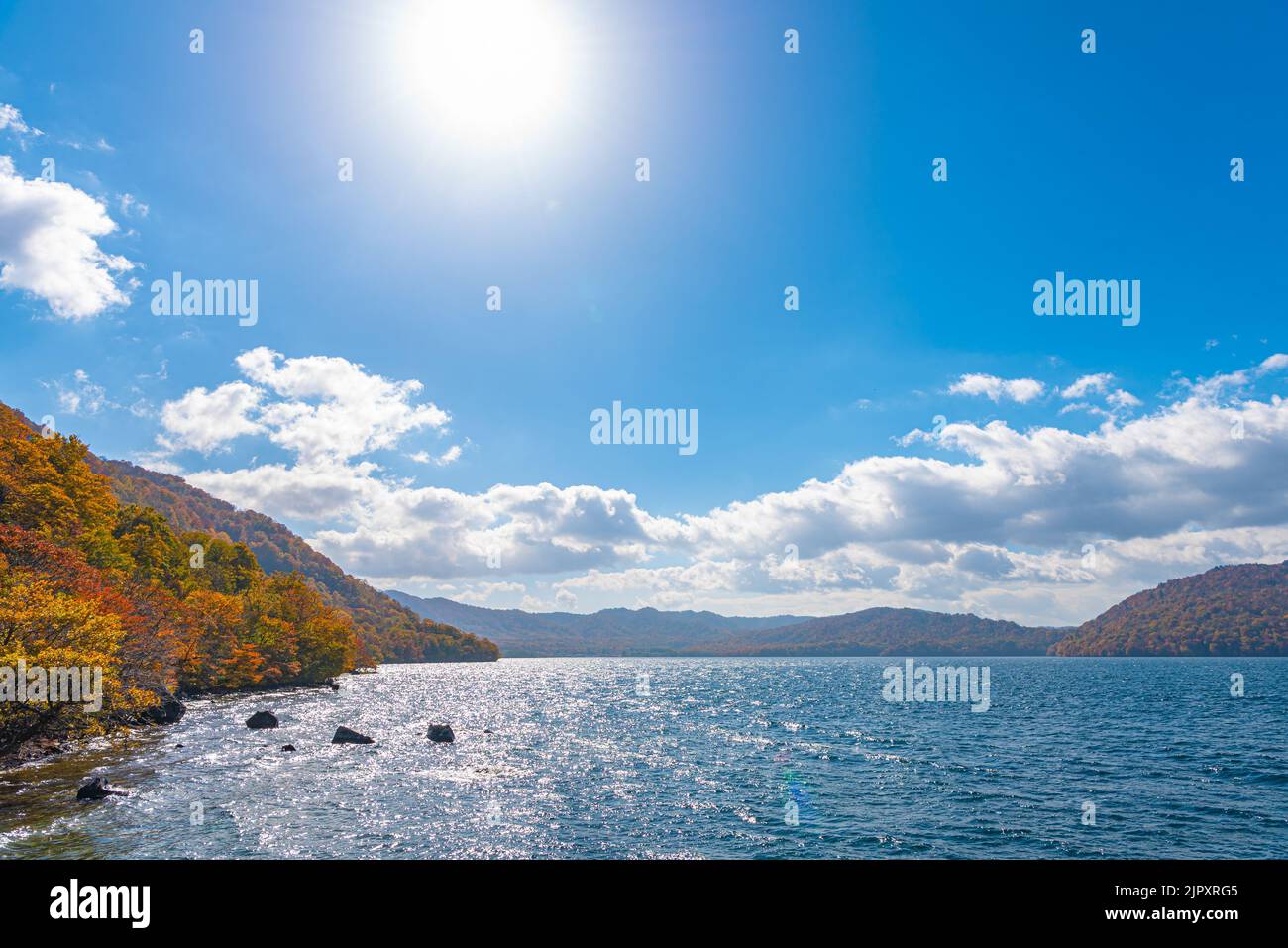 Lake Towada autumn sightseeing Cruises. Beautiful fall foliage view, blue sky sunny day. Towada ...