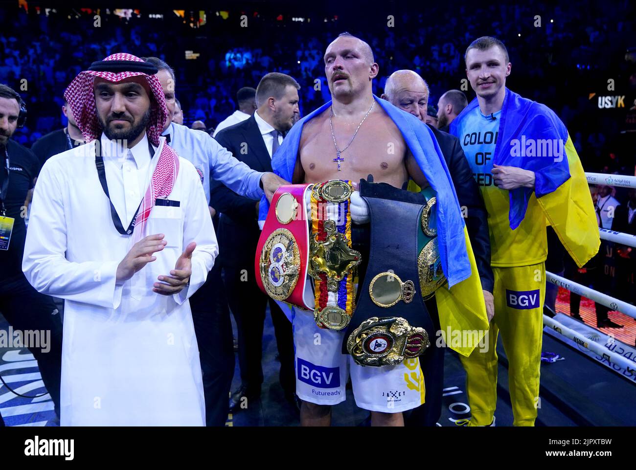 Oleksandr Usyk (centre) after winning the World Heavyweight Championship WBA Super IBF, IBO and ...