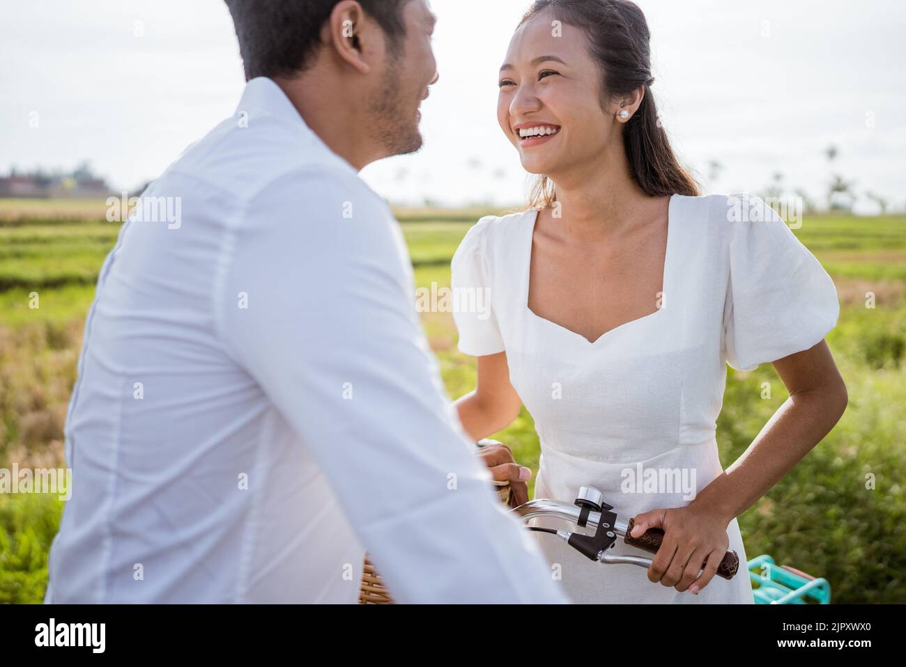 romantic couple looking at each other and laughing Stock Photo - Alamy