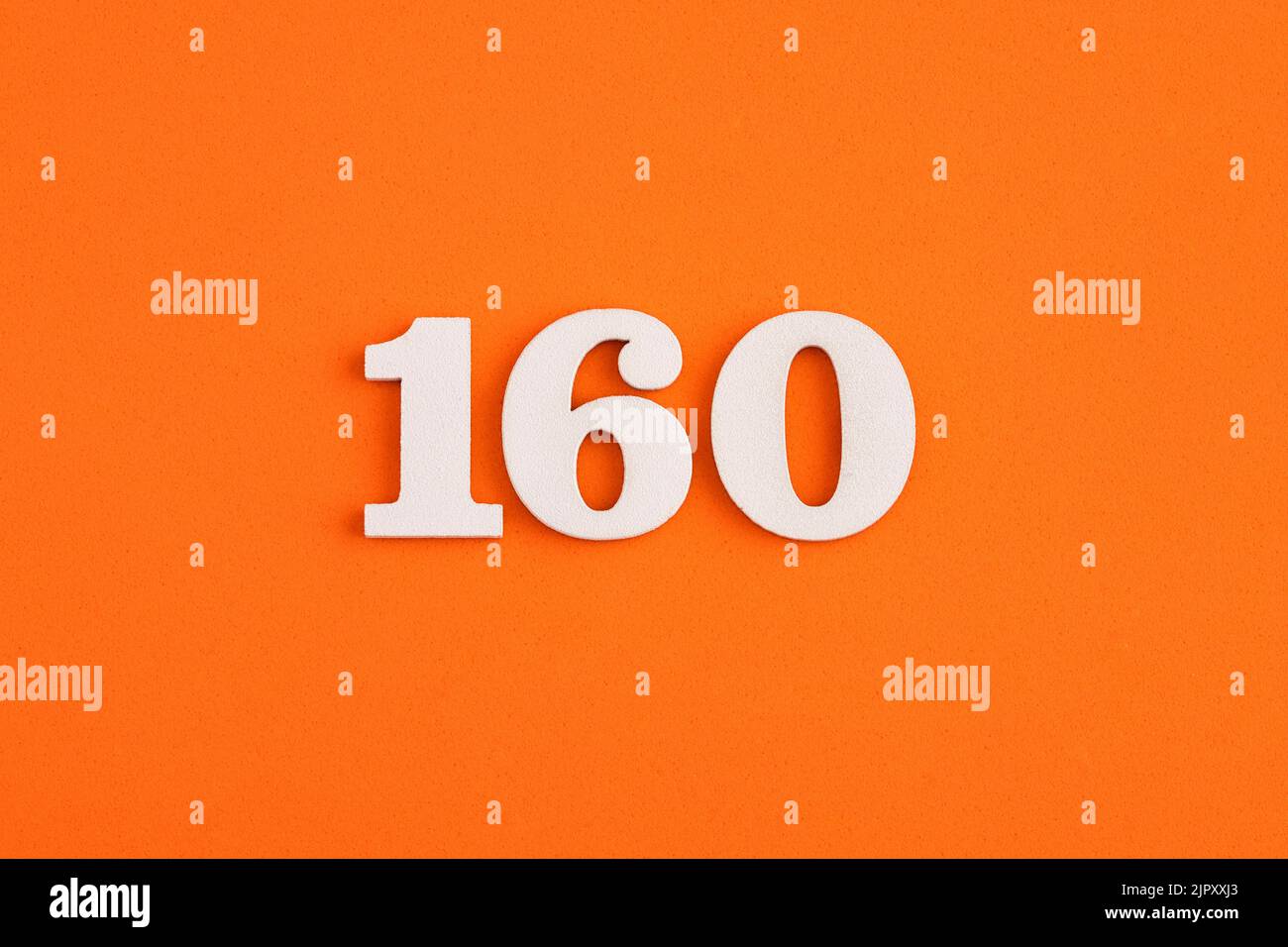 White wooden number 160 on eva rubber orange background Stock Photo - Alamy