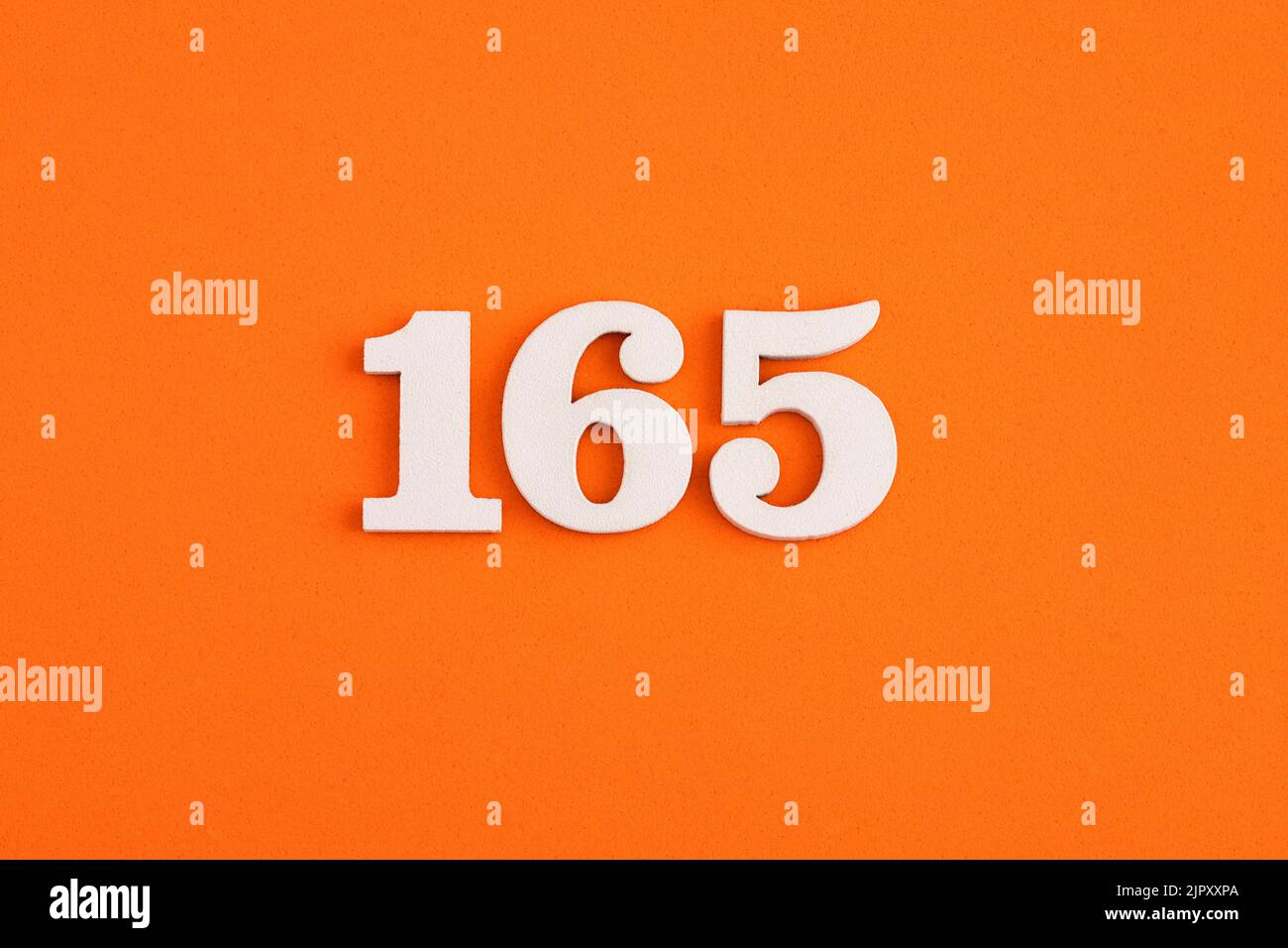 Number 165 - On orange foam rubber background Stock Photo - Alamy