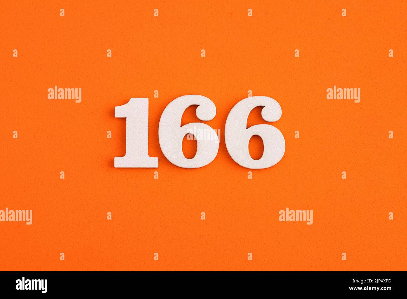 White wooden number 166 on eva rubber orange background Stock Photo - Alamy