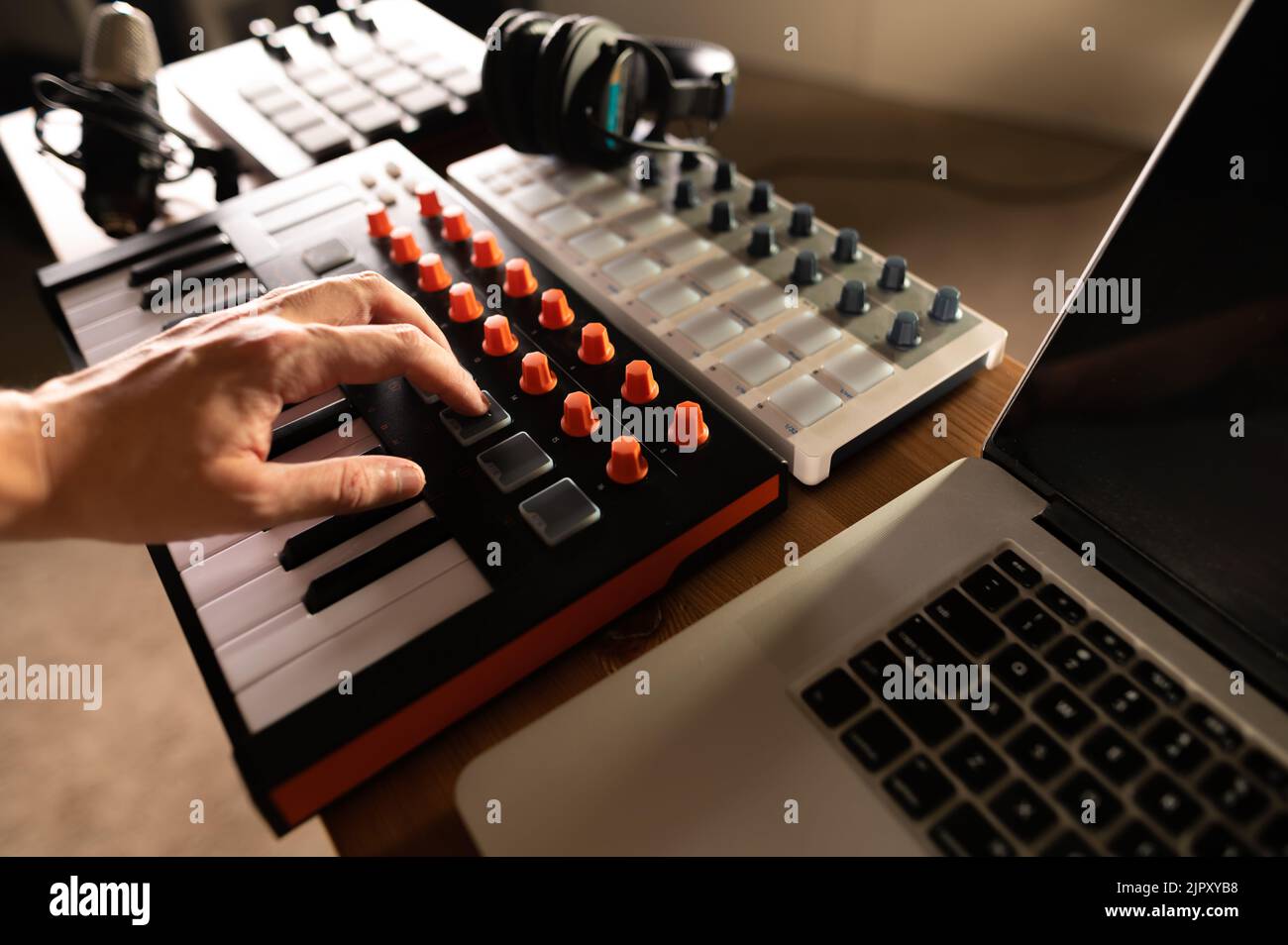 Studio musical equipment - midi keyboard, laptop, studio microphone ...