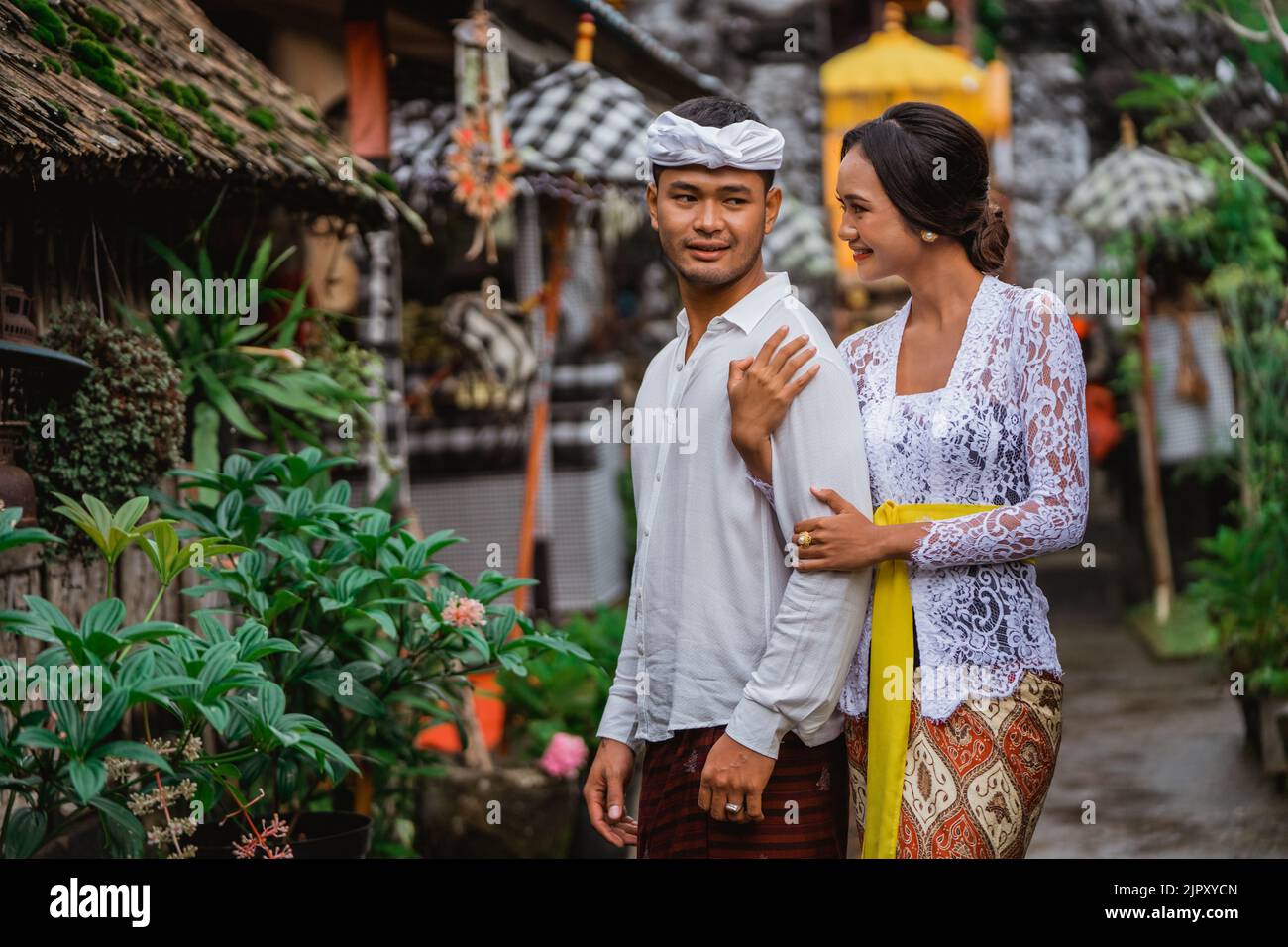 woman in balinese kebaya with her husband in typical bali village Stock ...