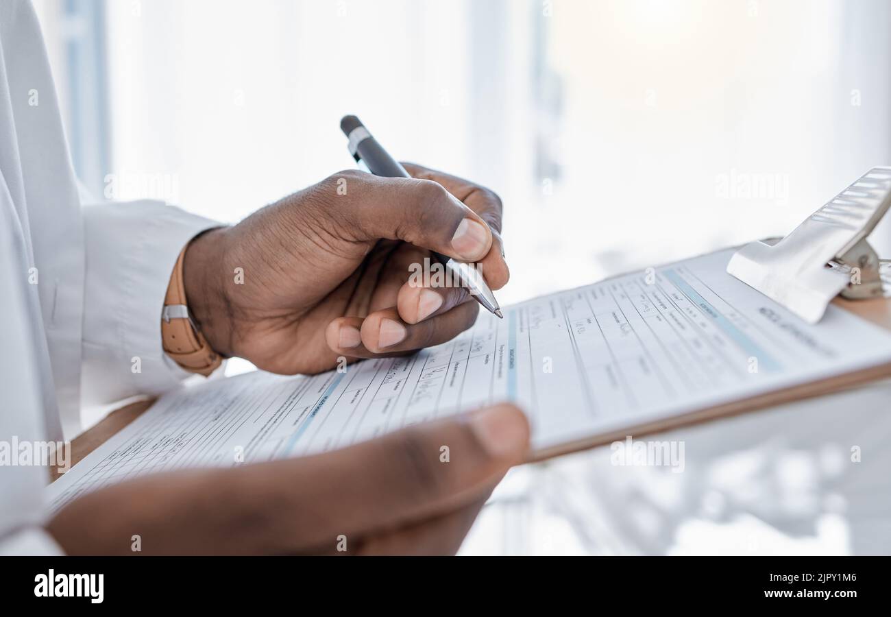 Doctor writing survey, insurance and claim form for medical paperwork ...