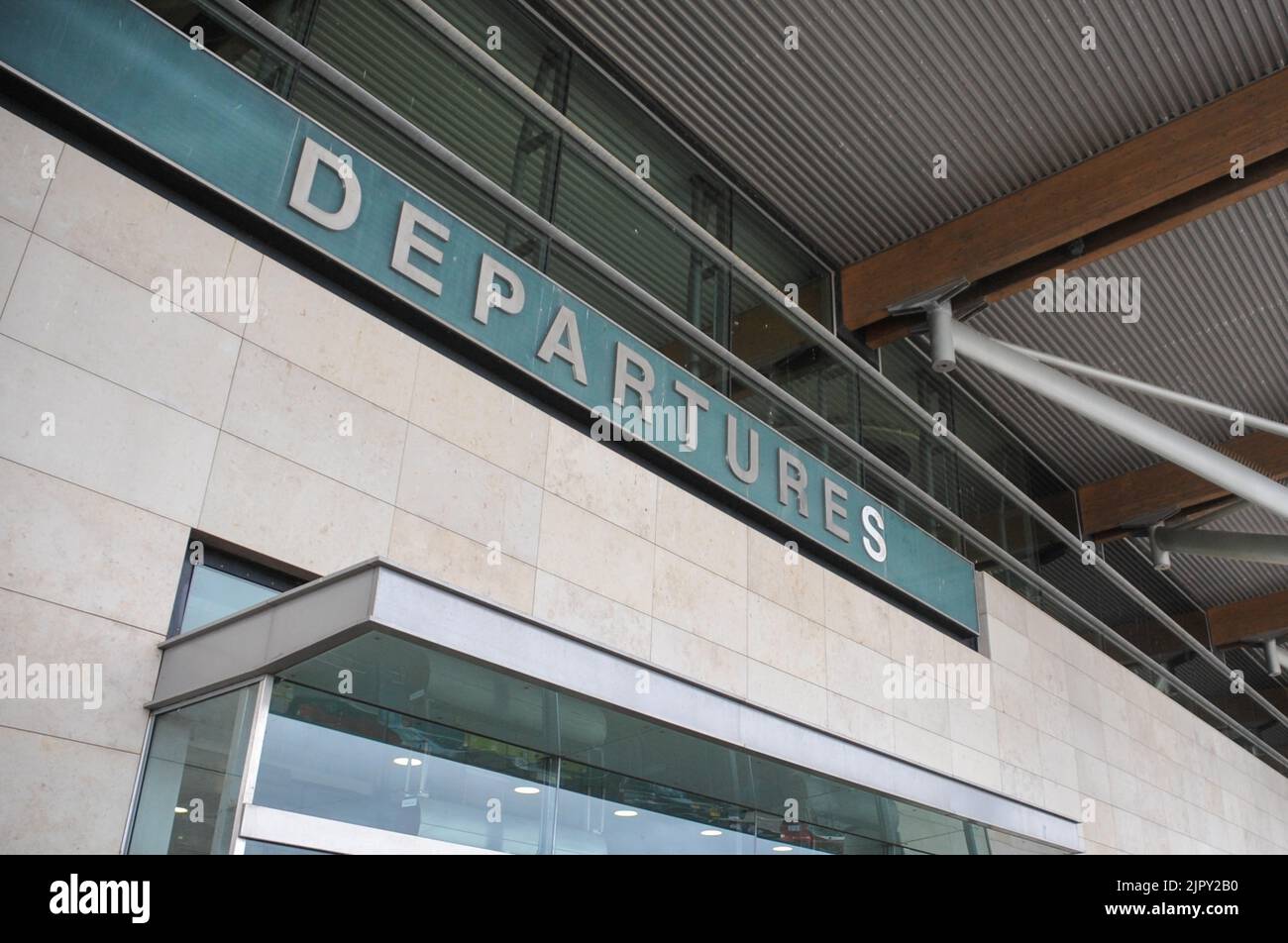 Departures sign at the exterior of building Stock Photo - Alamy