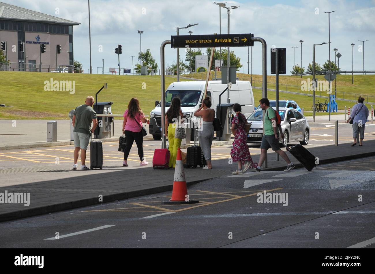 People waiting for Taxis outside of Cork Airport Stock Photo - Alamy