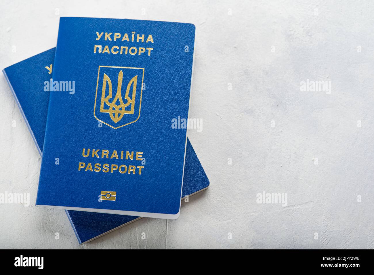 Biometric passports of citizens of Ukraine on a white background ...