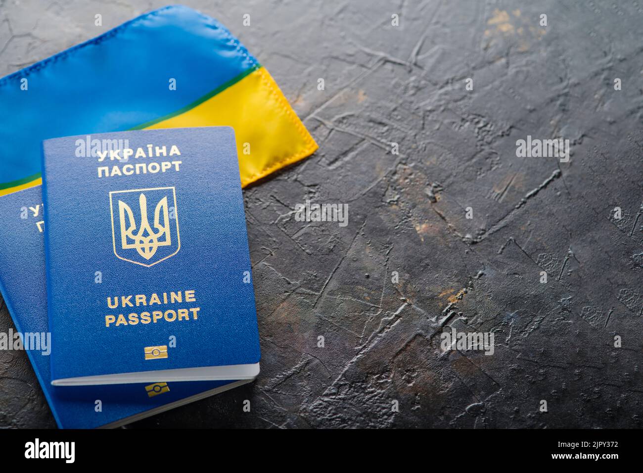 Ukrainian biometric passports with gold embossing on a blue background ...