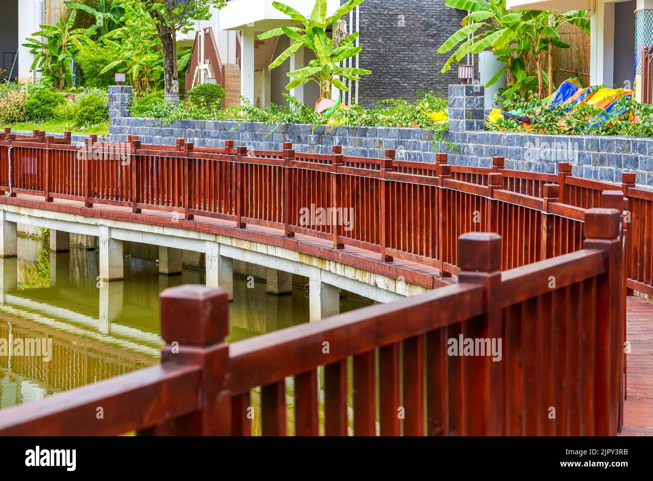 Wooden promenade landscape and walking path in residential complex ...