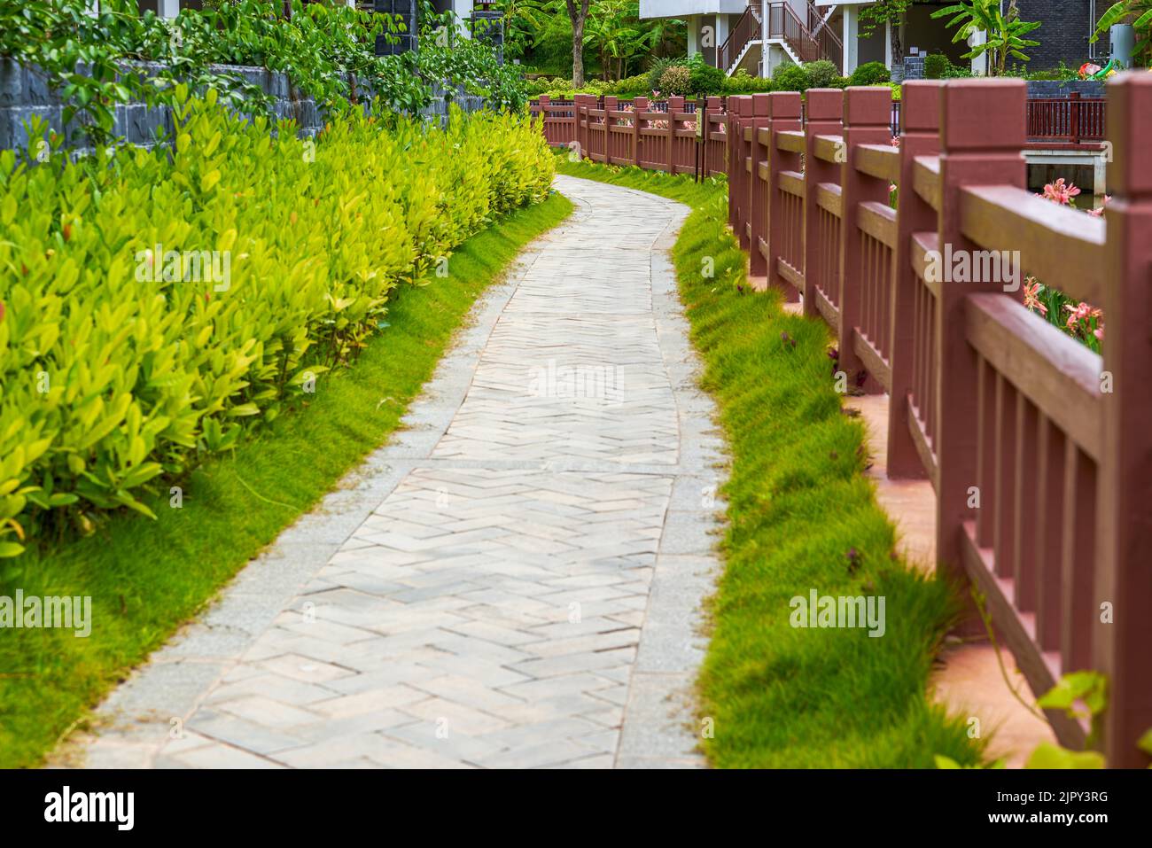 Wooden promenade landscape and walking path in residential complex ...
