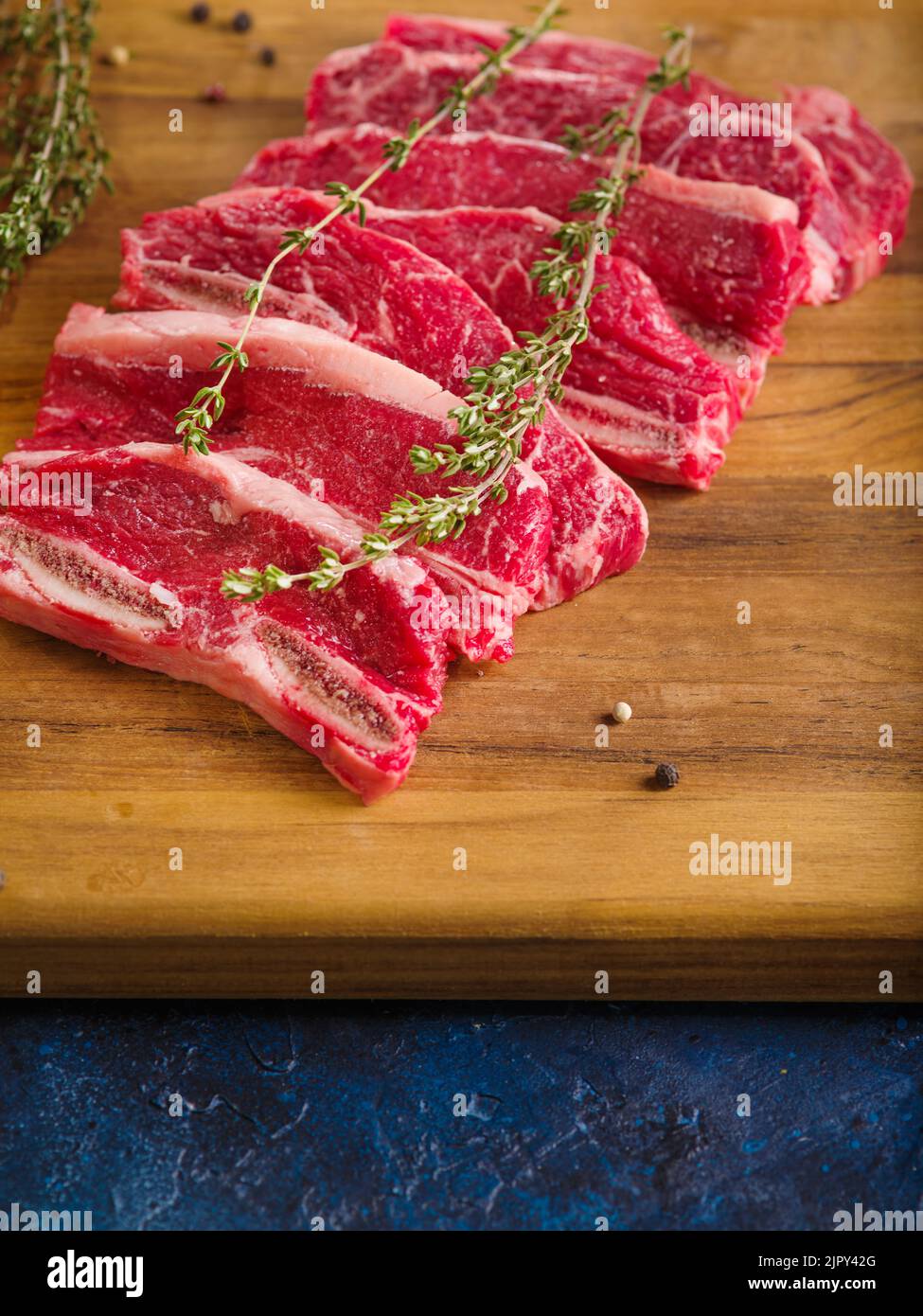 Homemade meat steaks on a cutting board. Close-up. The process of ...
