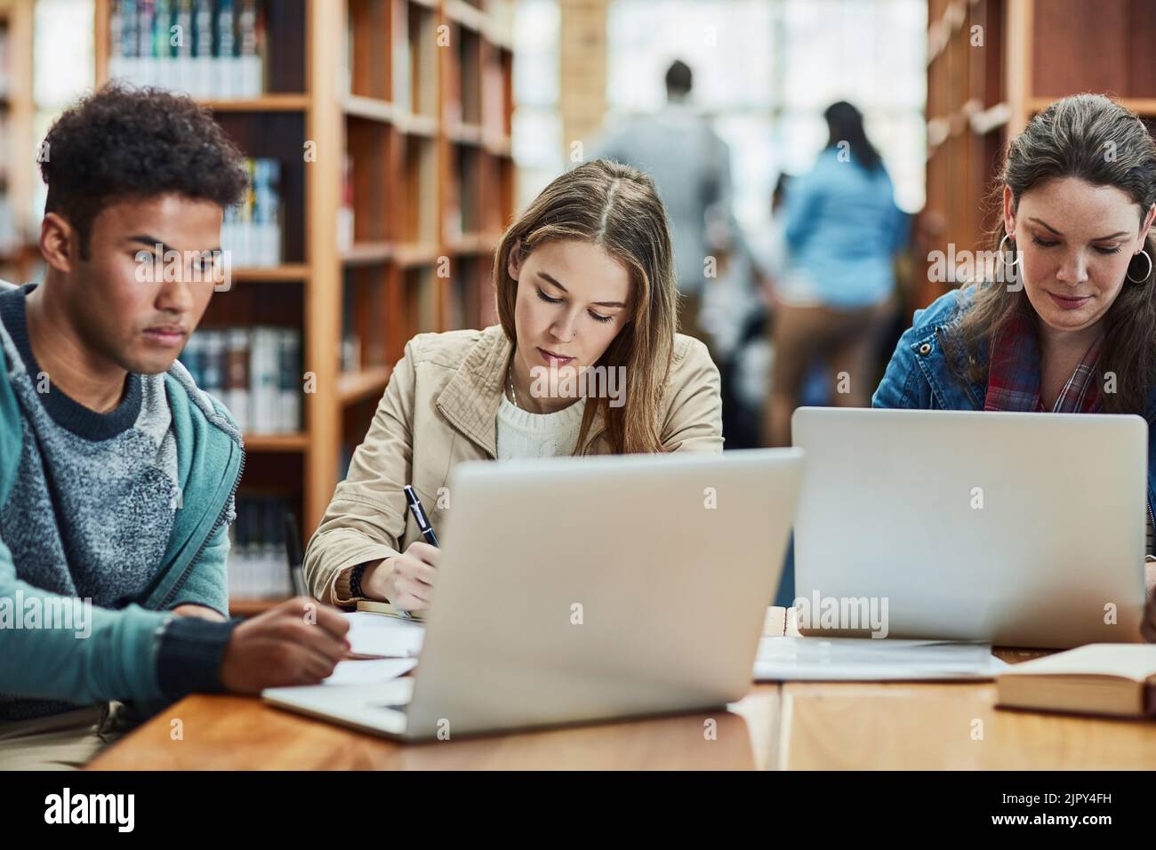 The hard work will all be worth the results. a group of university ...