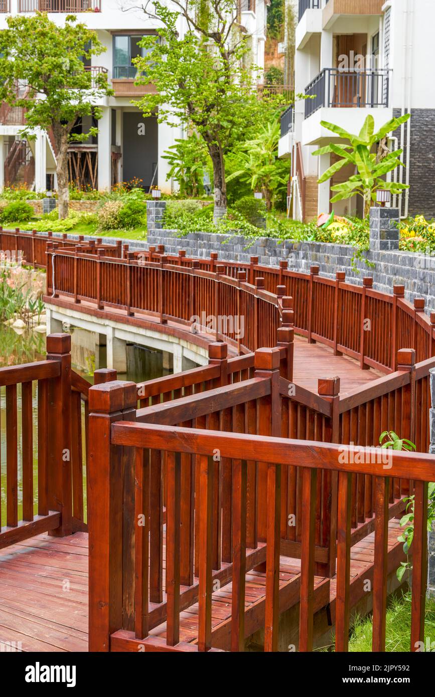 Wooden promenade landscape and walking path in residential complex ...
