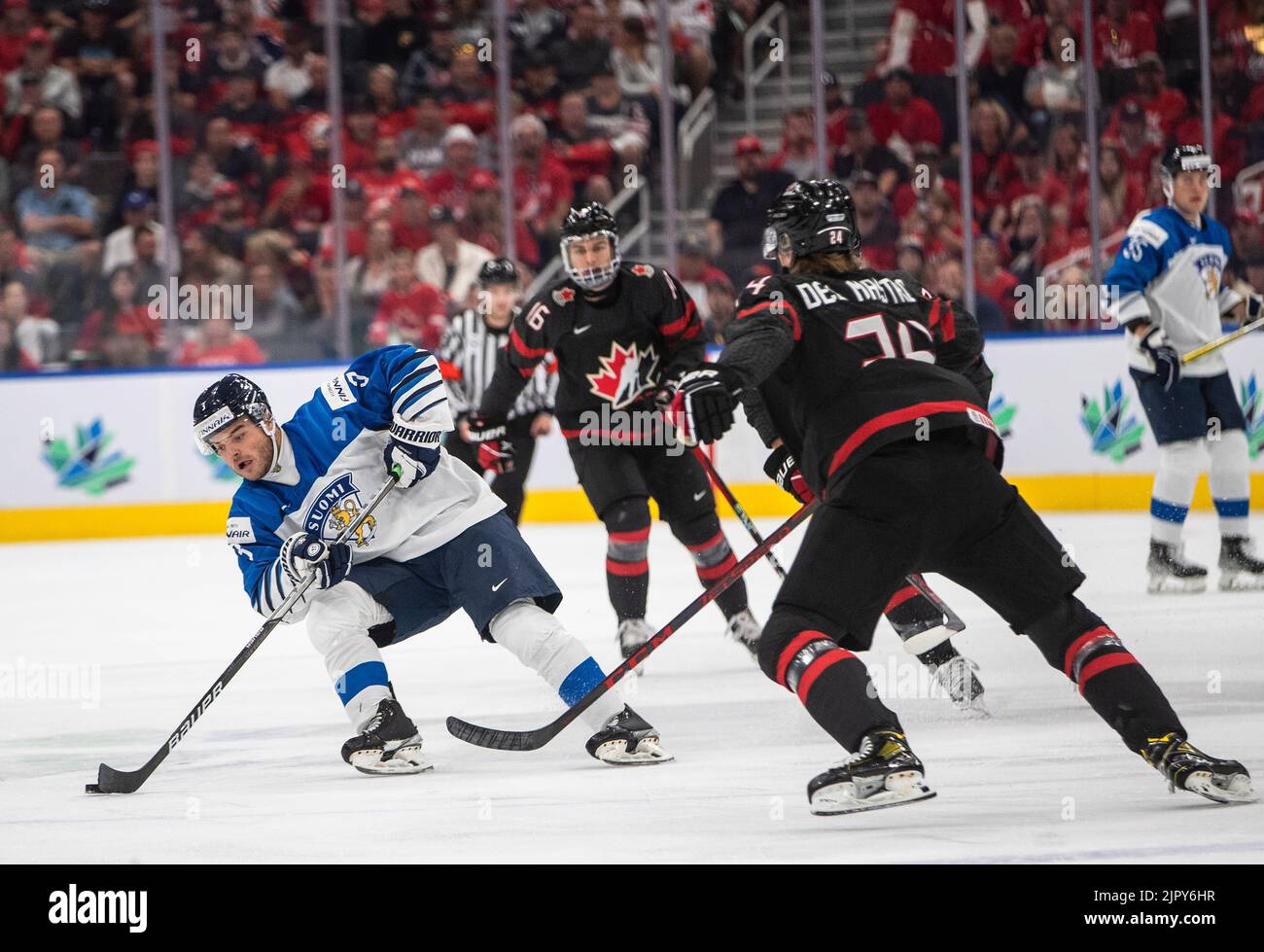 Canada's Connor Bedard (16) and Ethan Del Mastro (24) chase Finland's ...