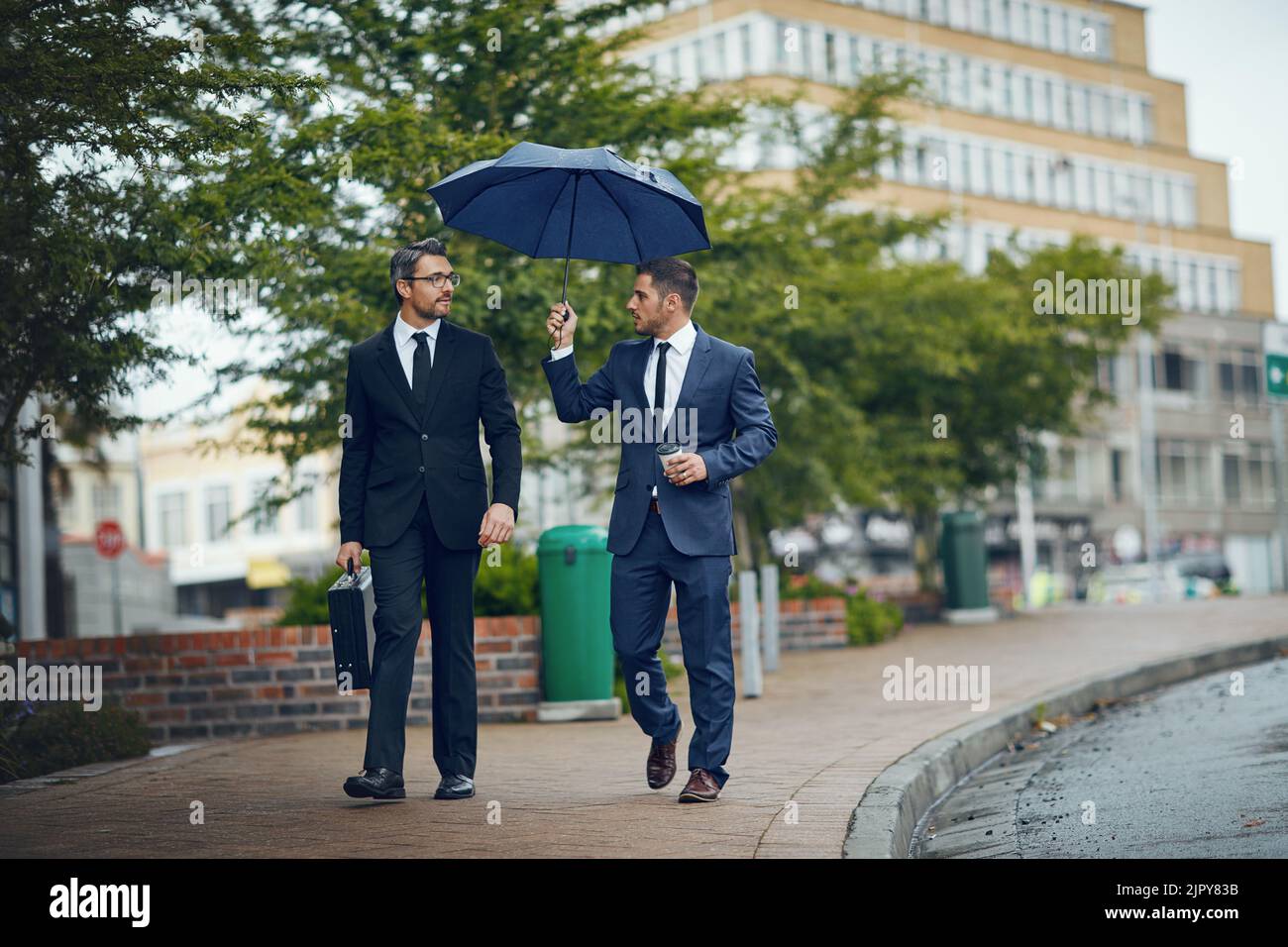 Making giant strides in the corporate world together. two corporate ...