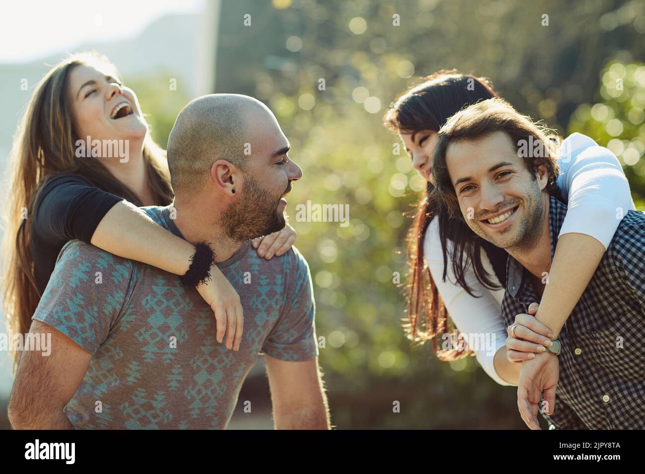 The more, the lovelier. two happy couples out on a double date Stock ...