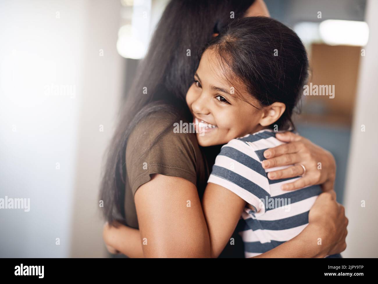 Nothing says comfort like a hug from mom. a happy mother and daughter ...