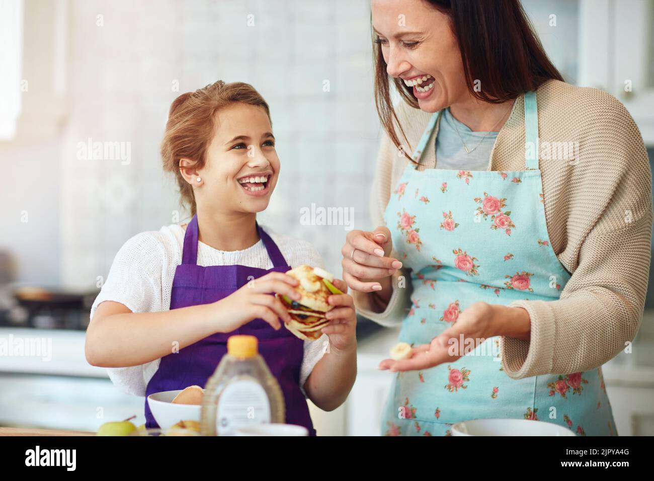 Cooking up something yummy with my mummy. a mother and daughter ...