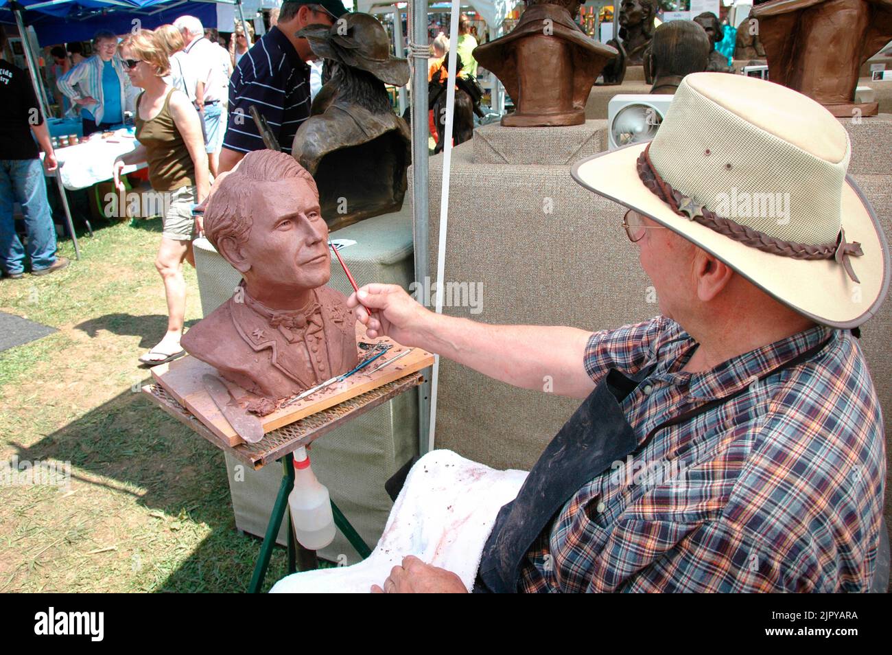 Hands working at an arts and crafts show making crafts and art Stock ...