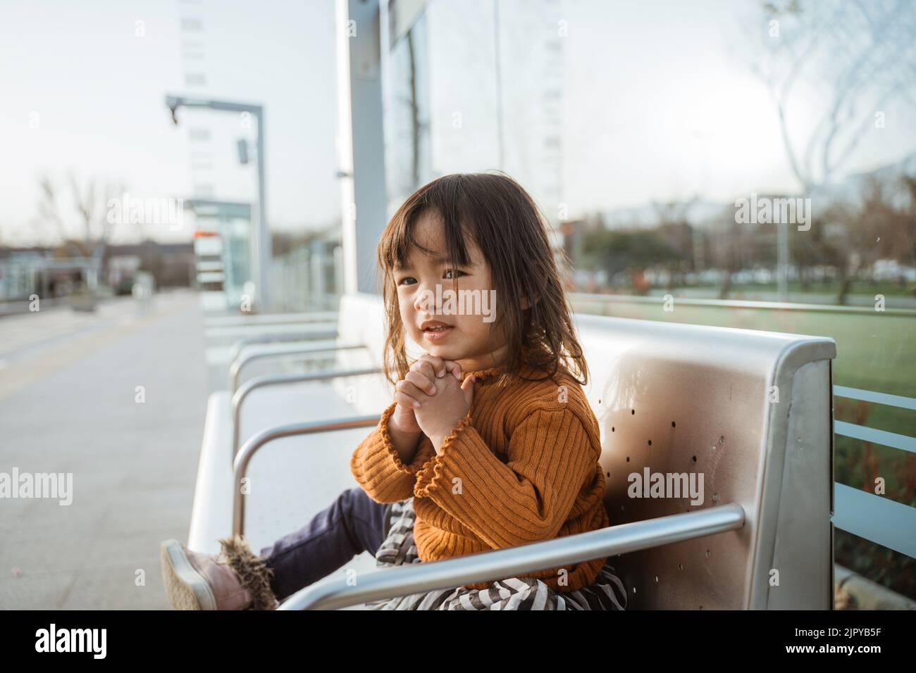 little girl waiting in station hoping the train to come Stock Photo - Alamy