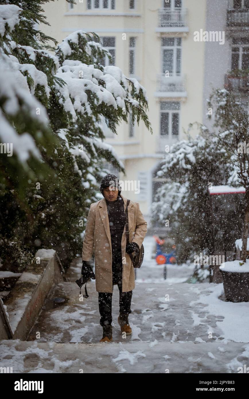 Male traveler in snow walking hi-res stock photography and images - Alamy