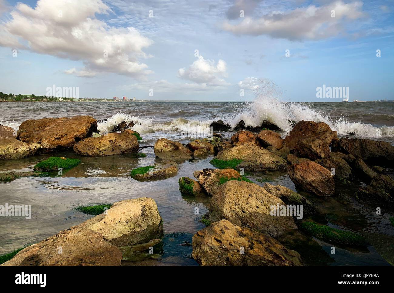Scene of the beach in a shiny day with wind and clouds Stock Photo - Alamy
