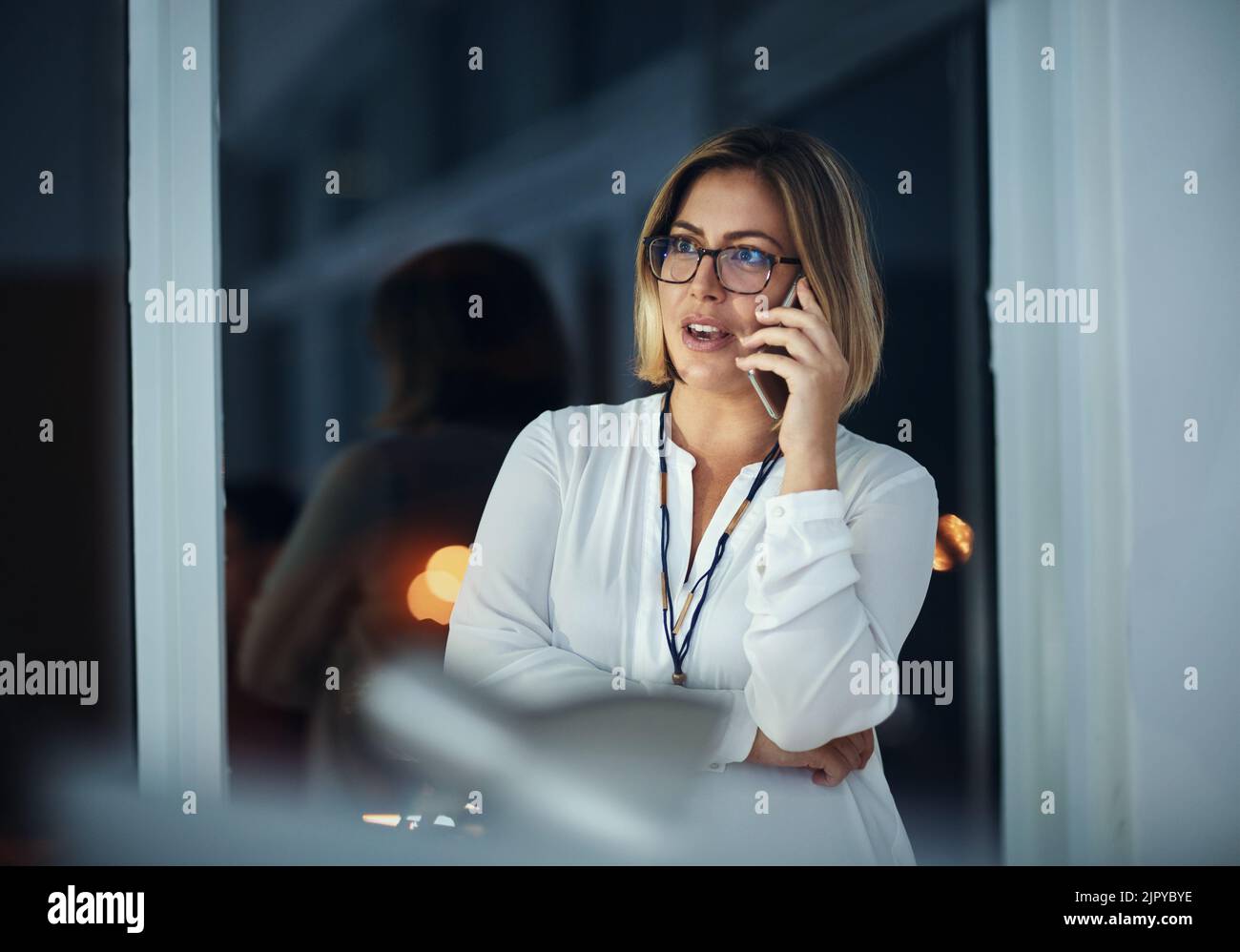 Dont wait up honey, Im working late. a businesswoman talking on a ...