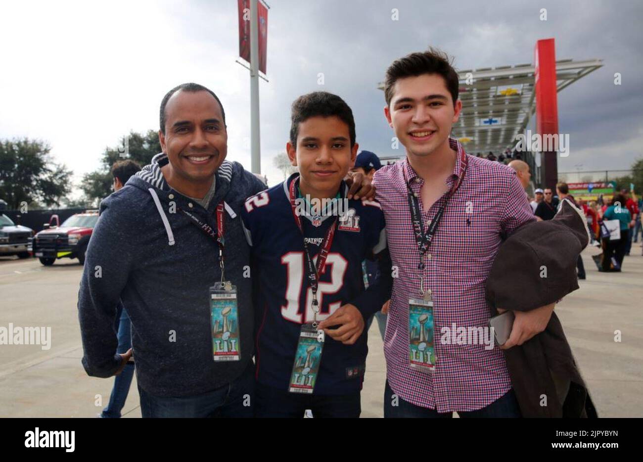 Three fans with tickets at Super Bowl LI Stock Photo - Alamy