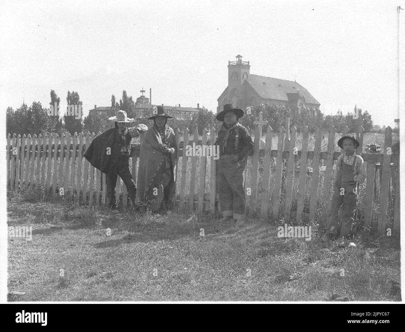 Three Indian Men and One Indian Boy in Front of a Fence (4172687674 ...