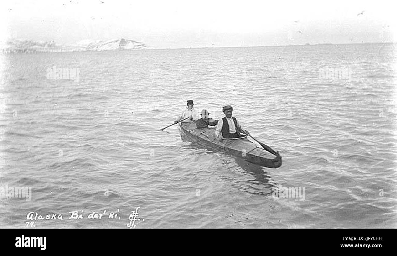 Three natives in bidarki, or skin covered boat on Cold Bay, ca 1912 ...