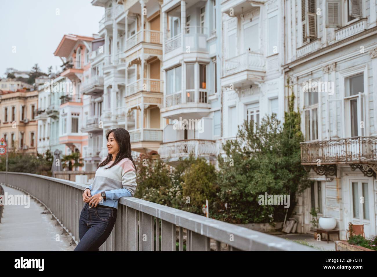 woman enjoying the beauty of building in arnavutkoy Stock Photo - Alamy