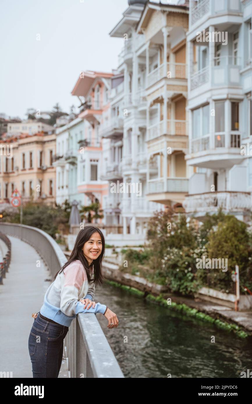 woman enjoying the beauty of building in arnavutkoy Stock Photo - Alamy