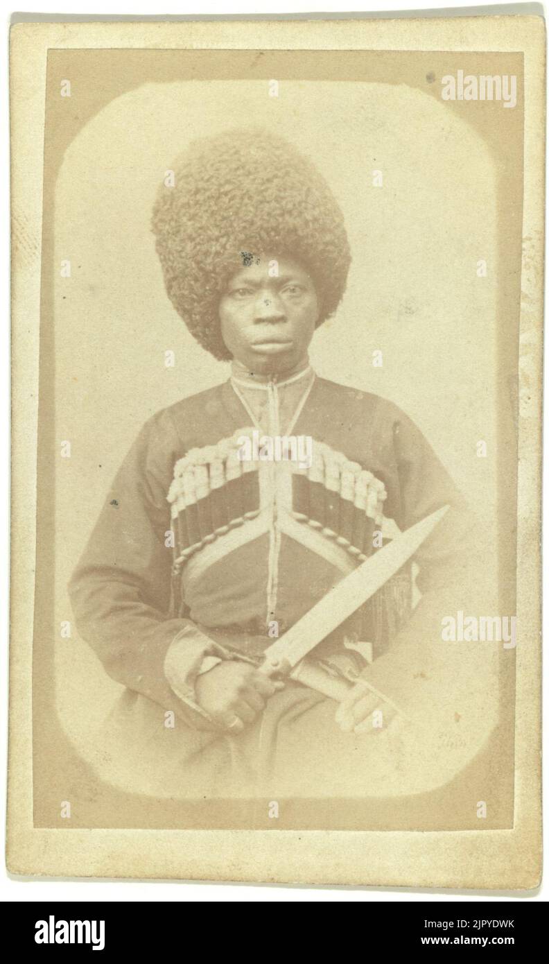 Three-quarter length portrait of man, seated, facing front Stock Photo ...