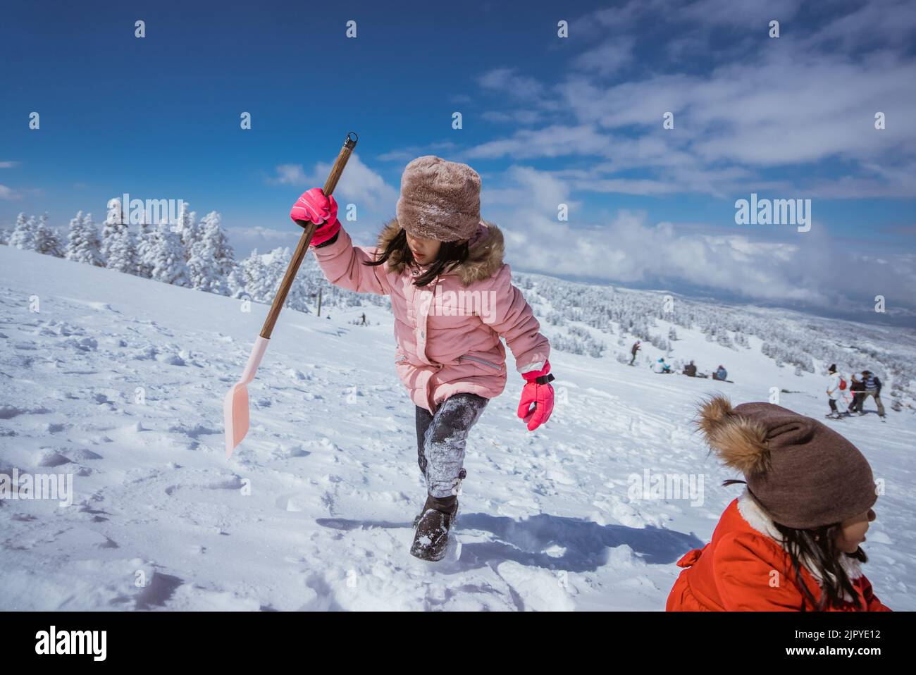 asian little sister playing in snowy winter together Stock Photo - Alamy