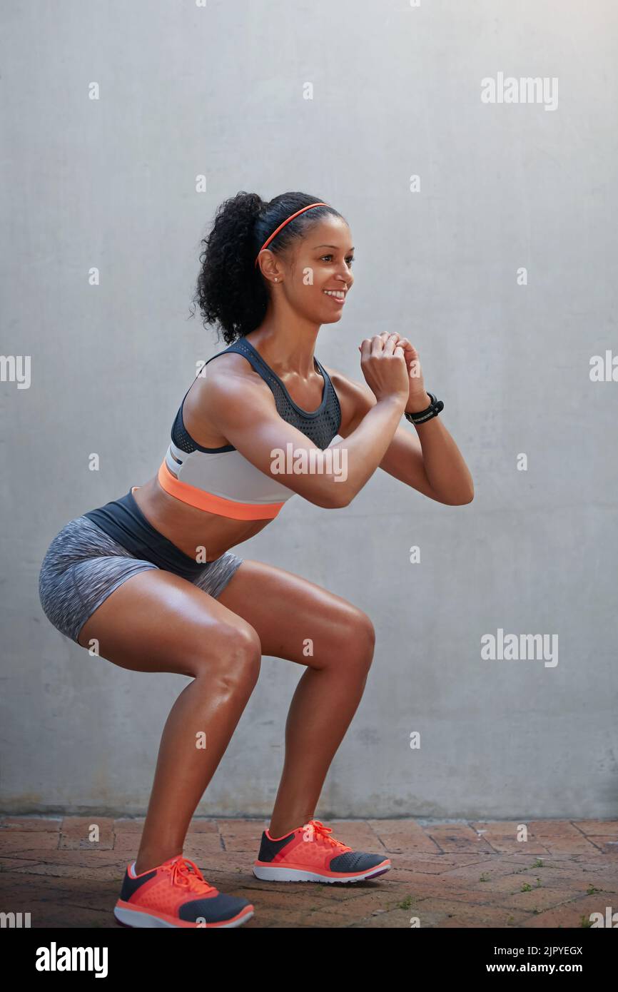 Stopping for a few squats. Full length shot of an attractive young ...