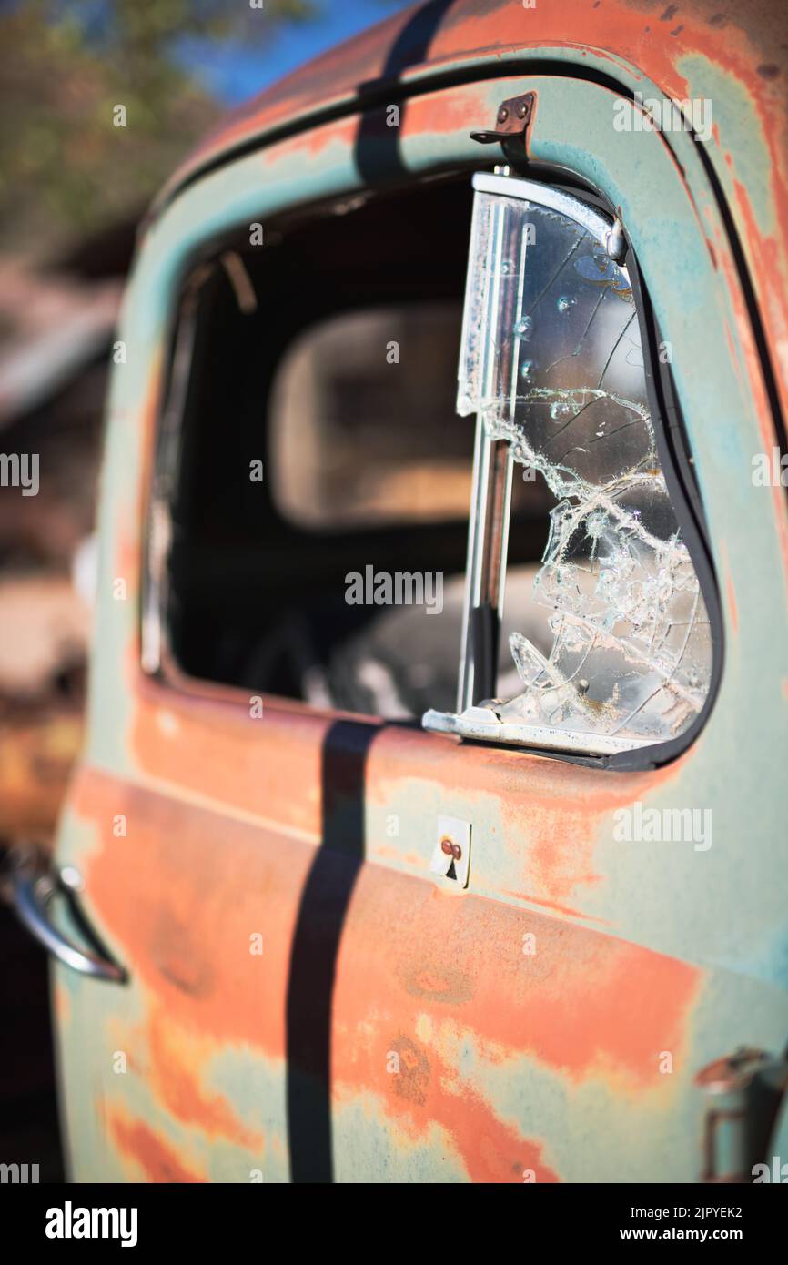 Broken glass window on old abandoned vehicle Stock Photo - Alamy