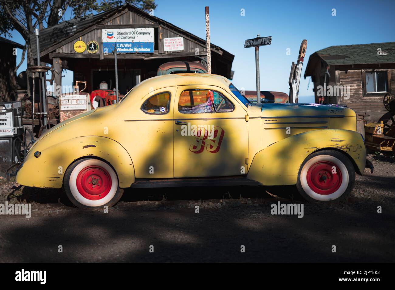 Old Yellow Car at a deserted gas station Stock Photo - Alamy