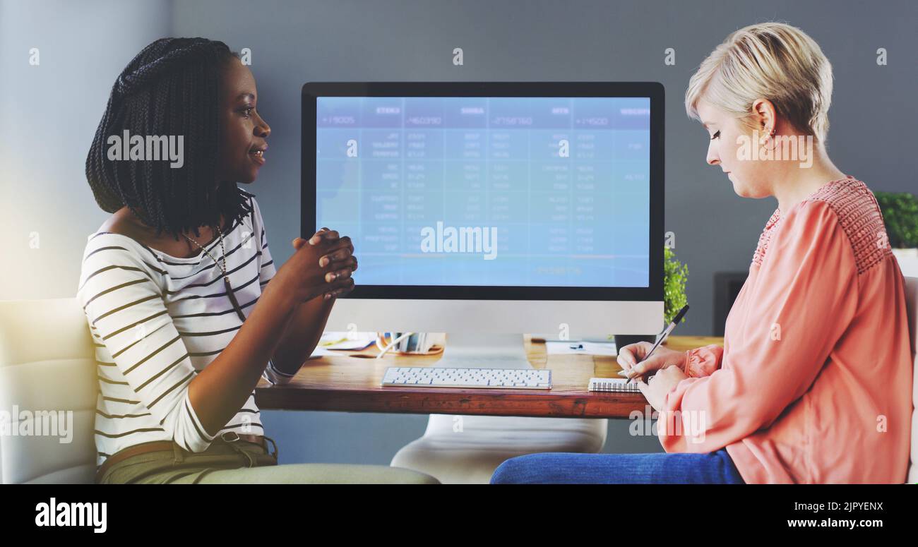 Putting their heads together for a quick brainstorming session. two ...