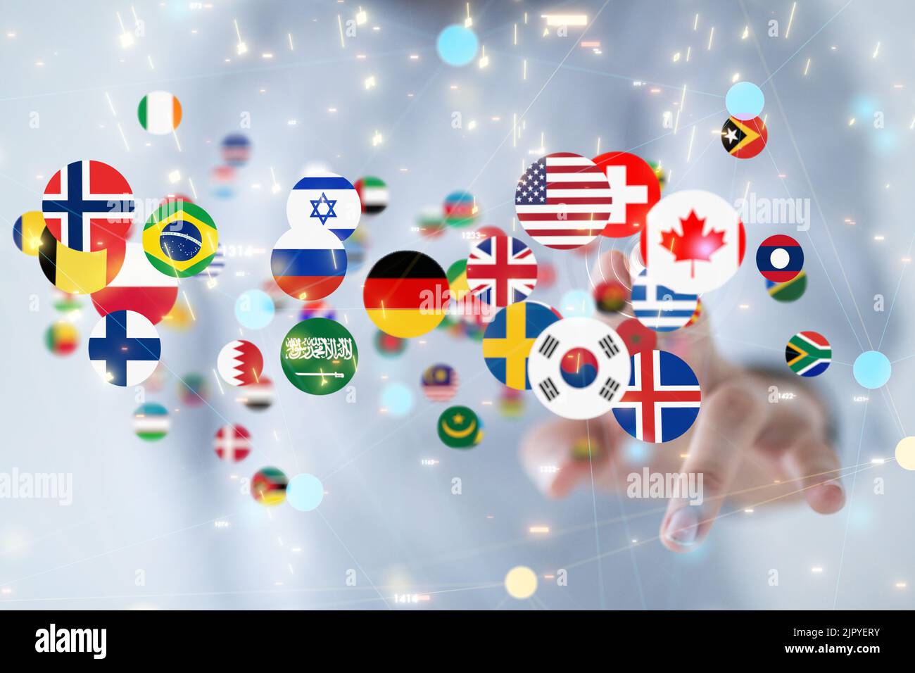 A hand touching 3D rendered round flags of countries Stock Photo - Alamy