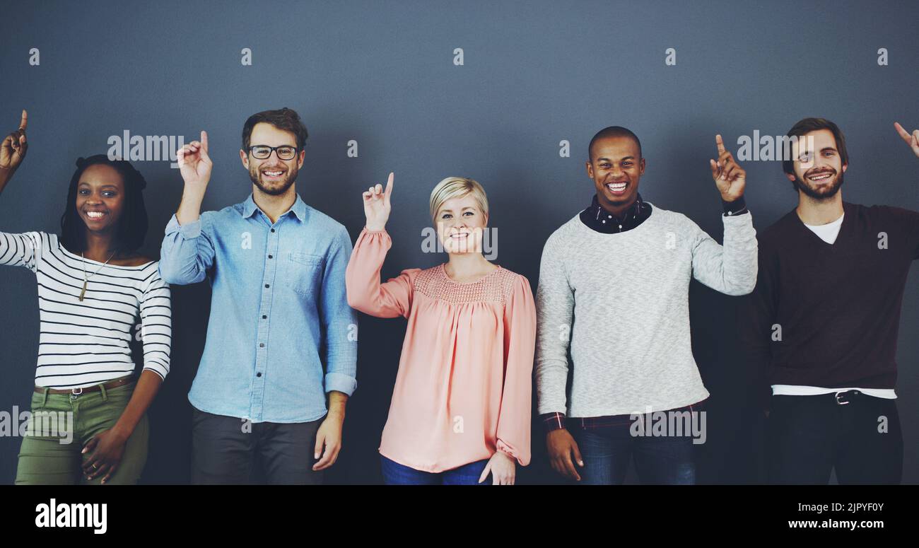 Look up and youll see why were smiling. Studio shot of a diverse group ...