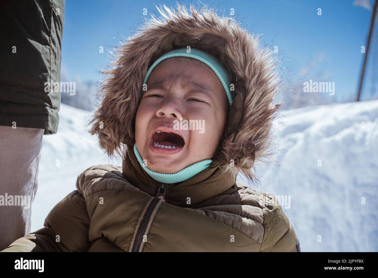 boy crying outloud while standing outside in the snow Stock Photo - Alamy