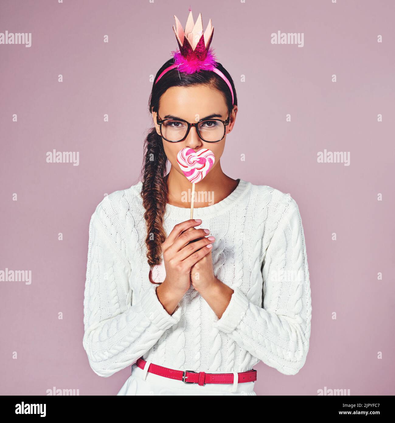 Forget the sweet talk. a young woman posing with a party crown and a ...